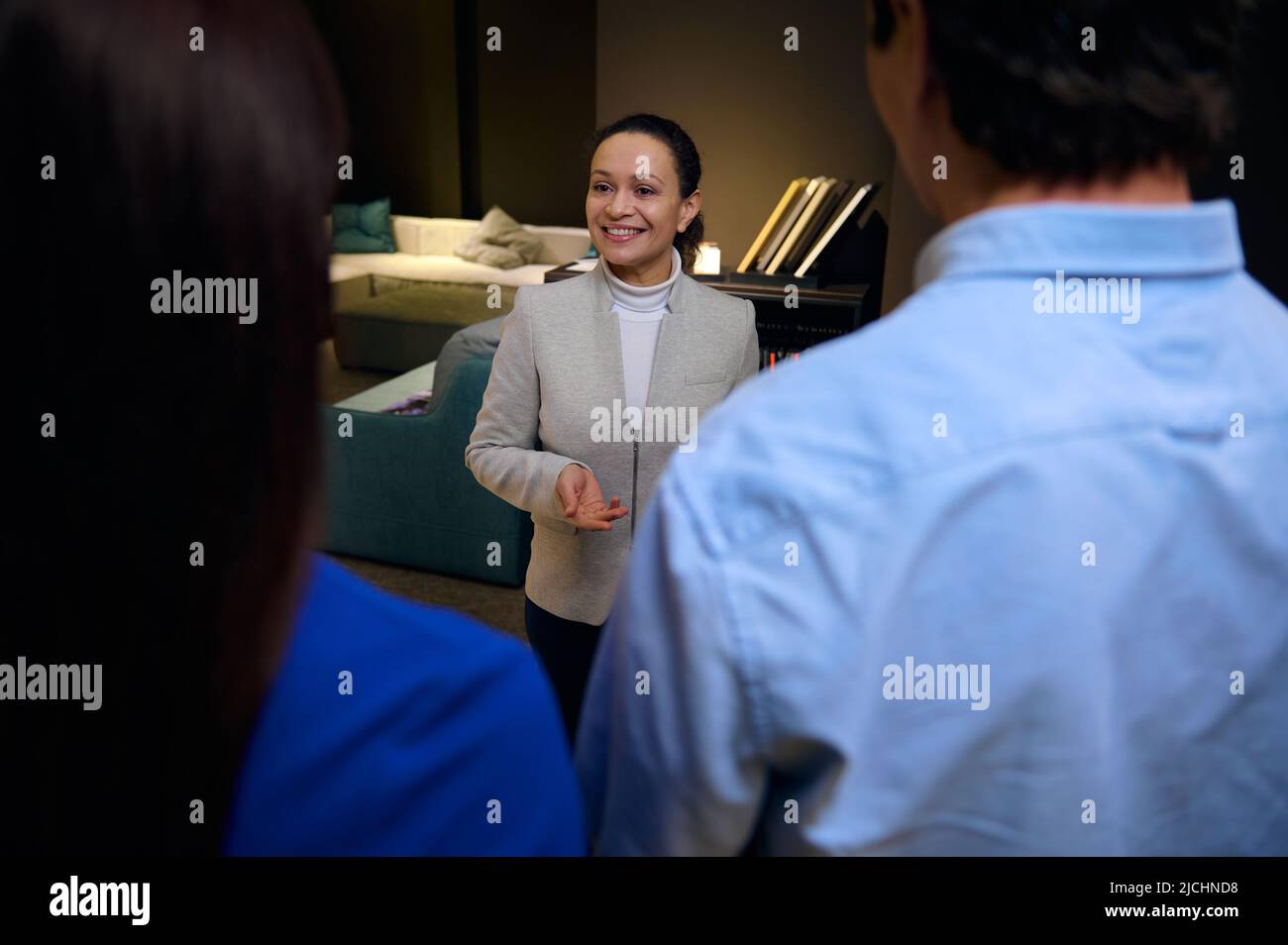 View through customers shoulders to a charming African American woman ...