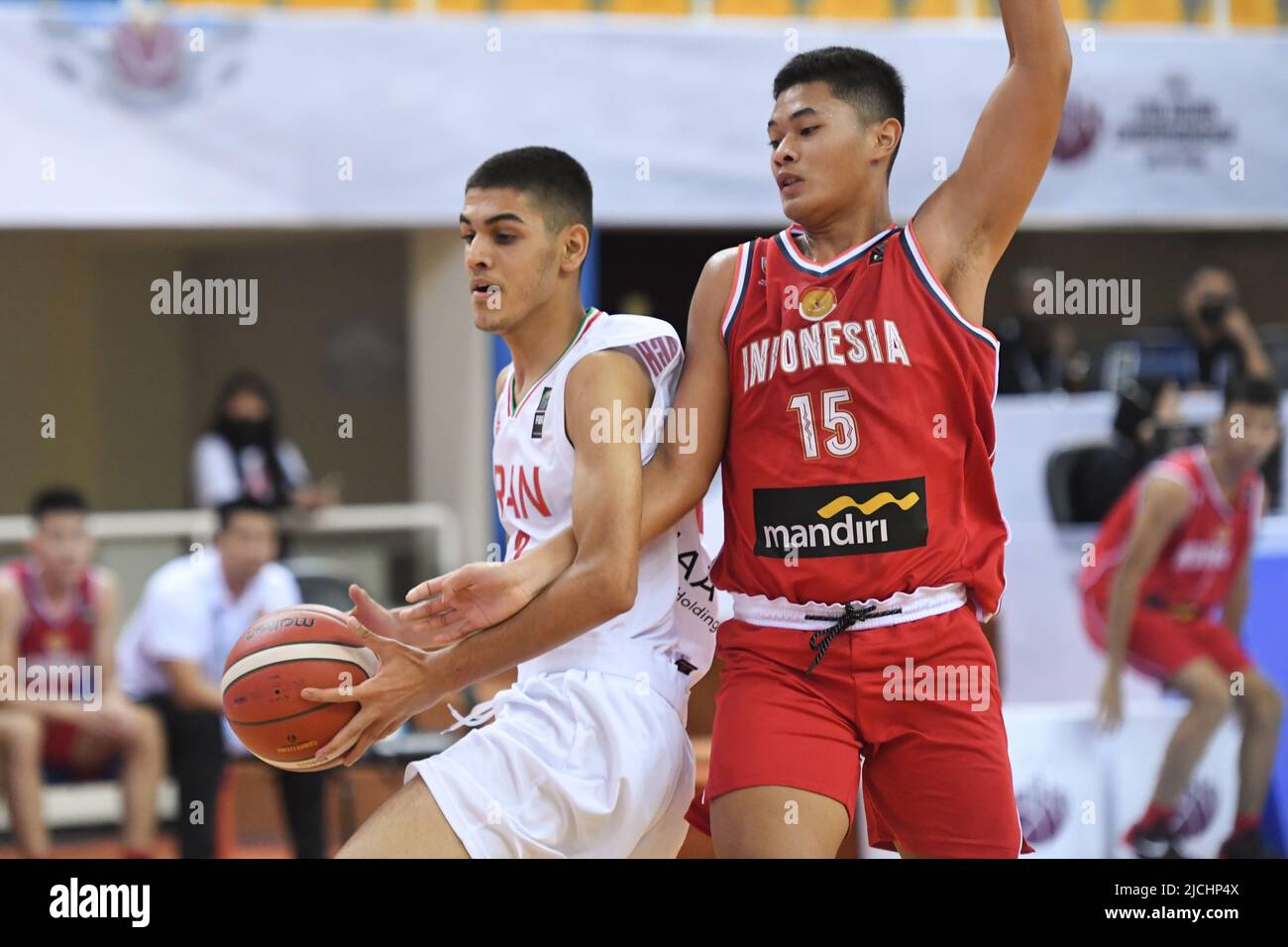 Mojtaba Yaghoubi (L) of Iran Basketball team and I Nyoman Aldo Dharma Yudha (R) of Indonesia ...