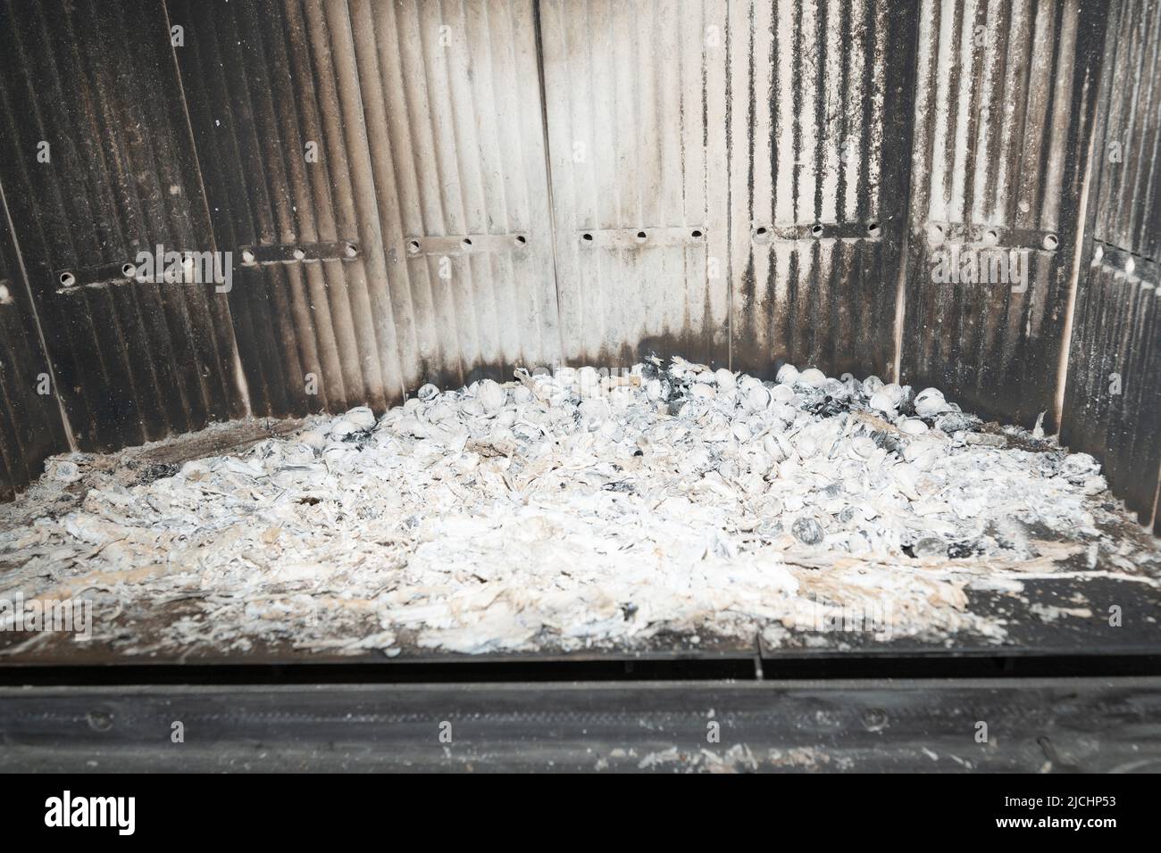 Fireplace and ashes close up, fireplace in the middle with fireclay ...