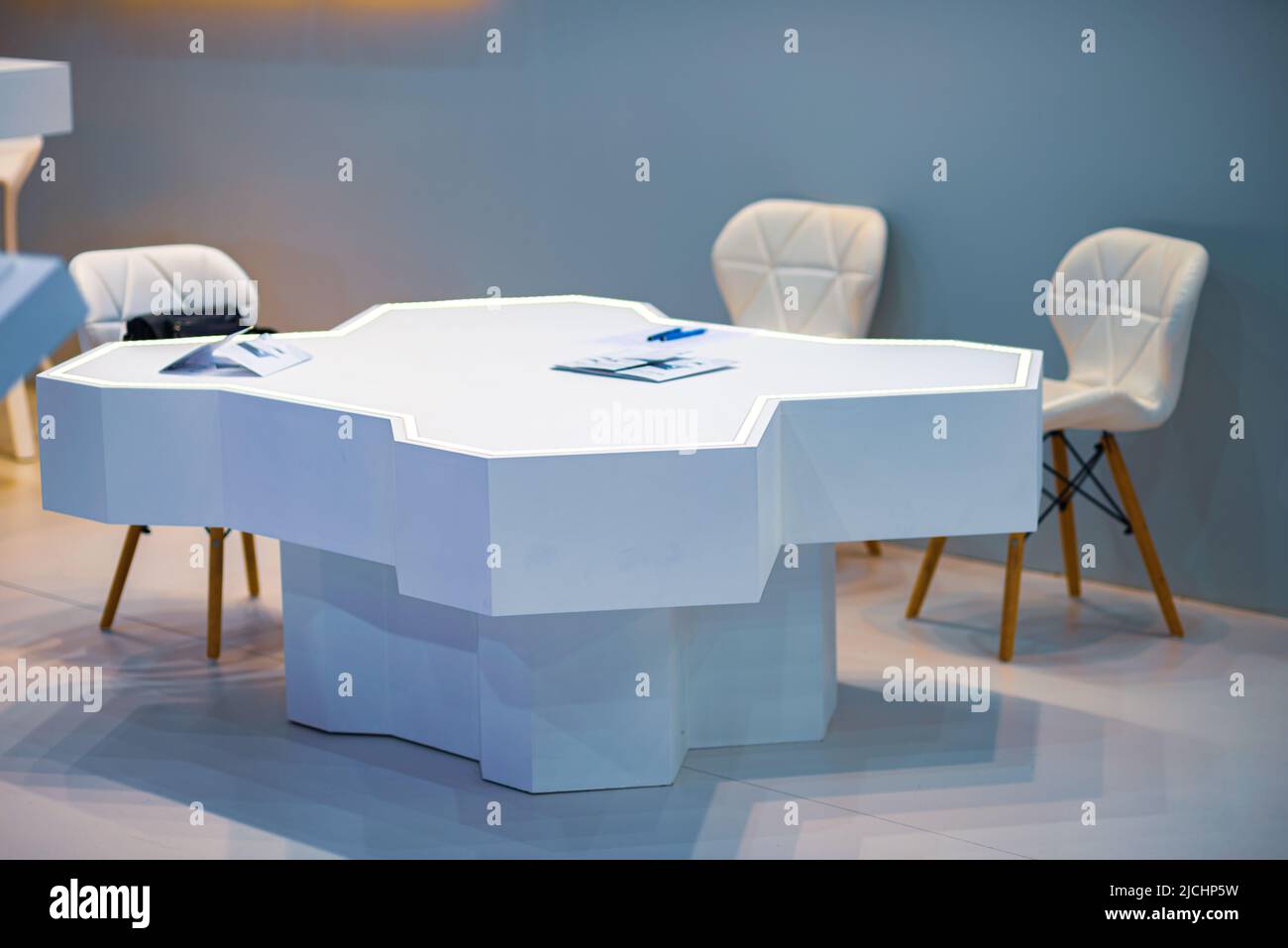 White table with chairs for negotiations Stock Photo - Alamy