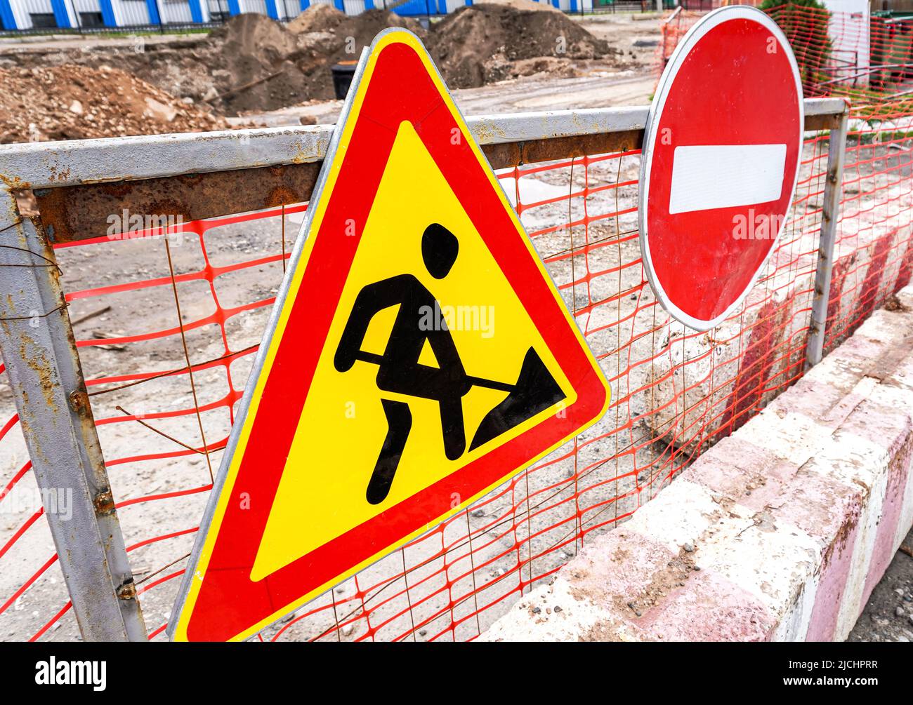Road works traffic sign at the city street. Under construction road ...