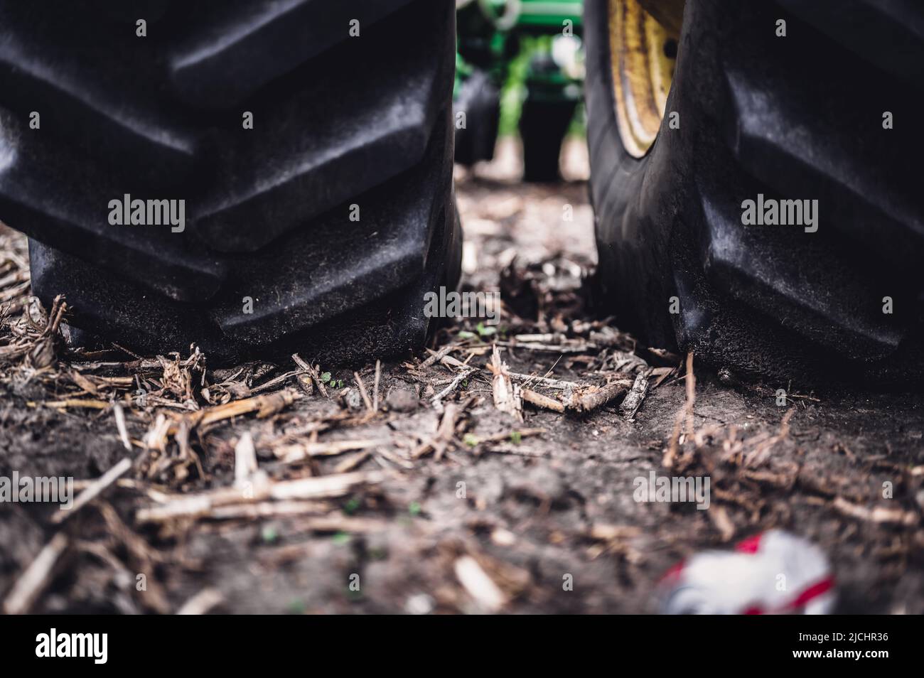 Soil compaction caused by a dual tractor tires over topsoil dirt in an ...
