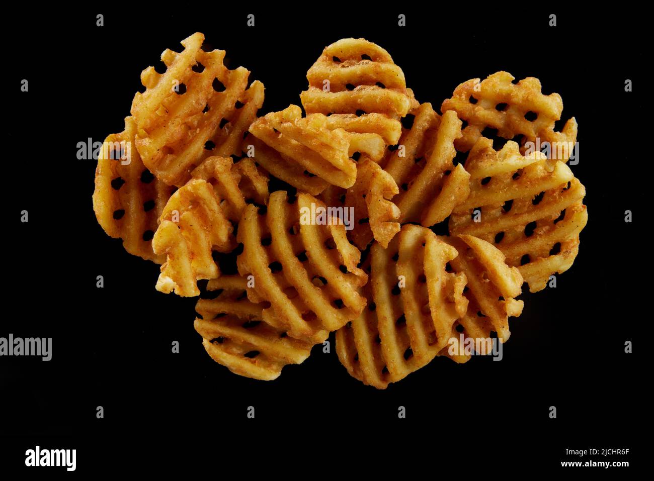 Top view portion of appetizing spicy potato grids with crispy crust ...