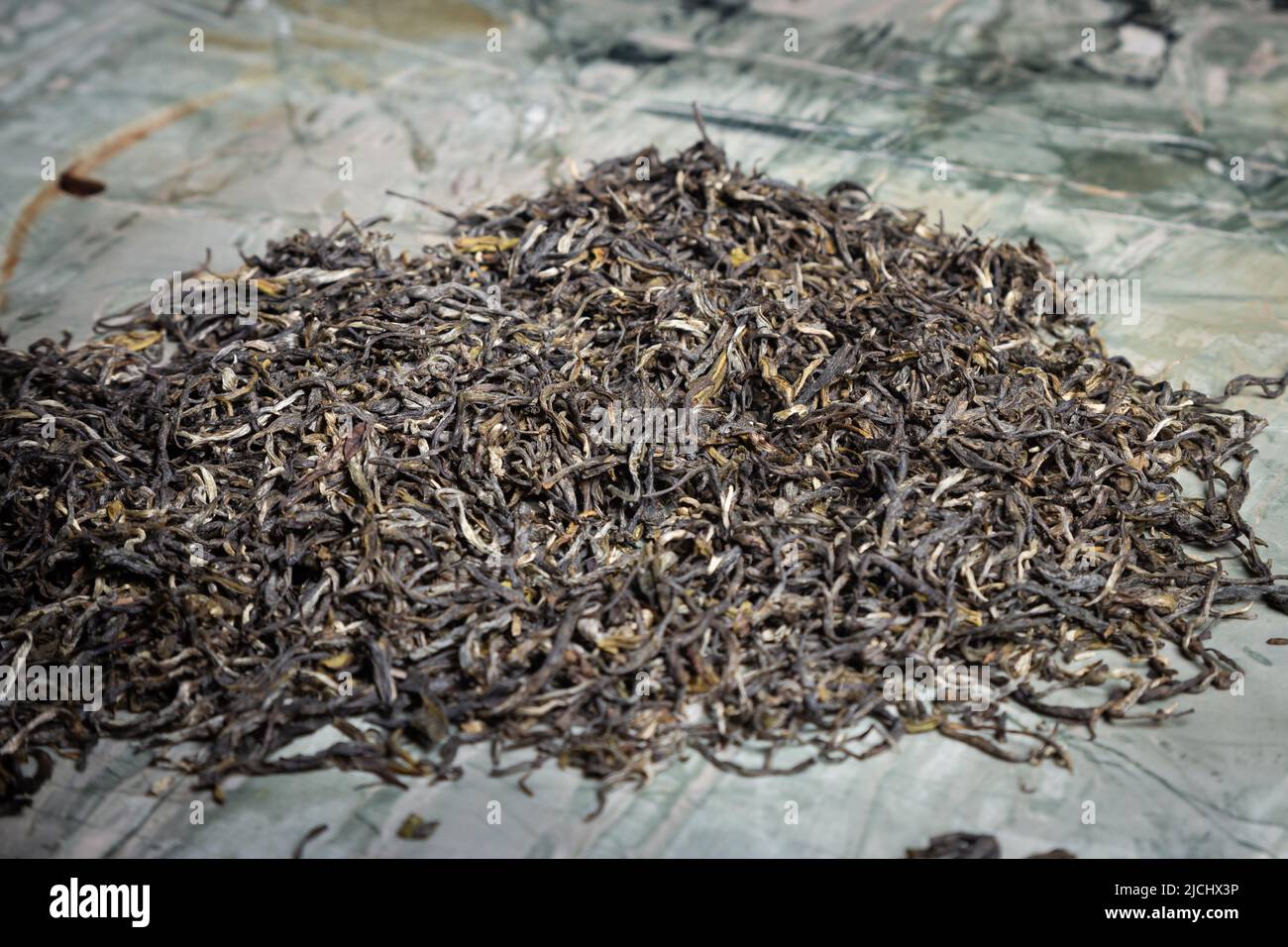 Pu-erh fermented Chinese tea in a roll Stock Photo - Alamy