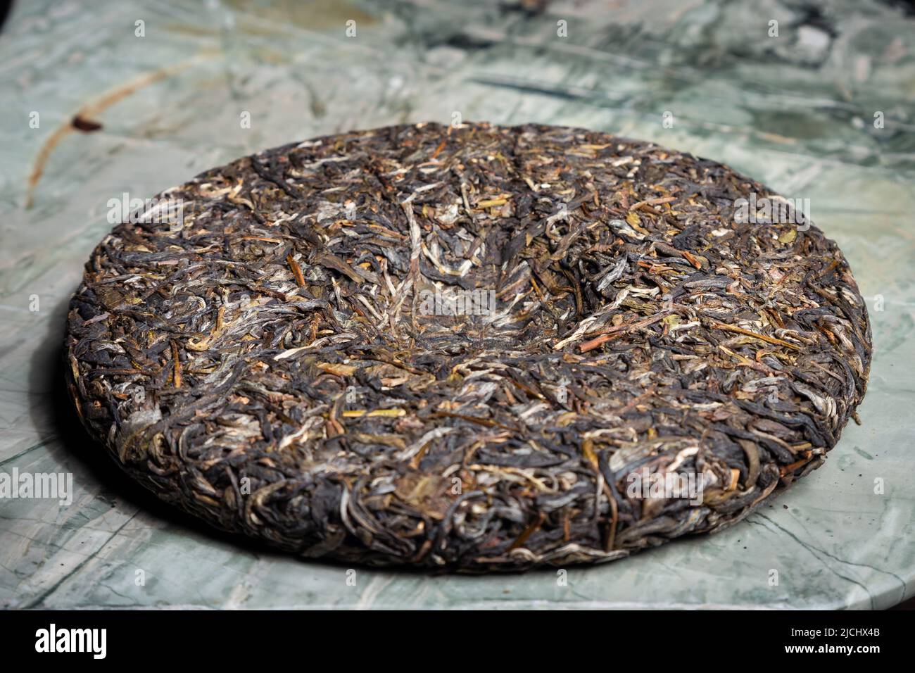 Pu-erh fermented Chinese tea in a roll Stock Photo - Alamy