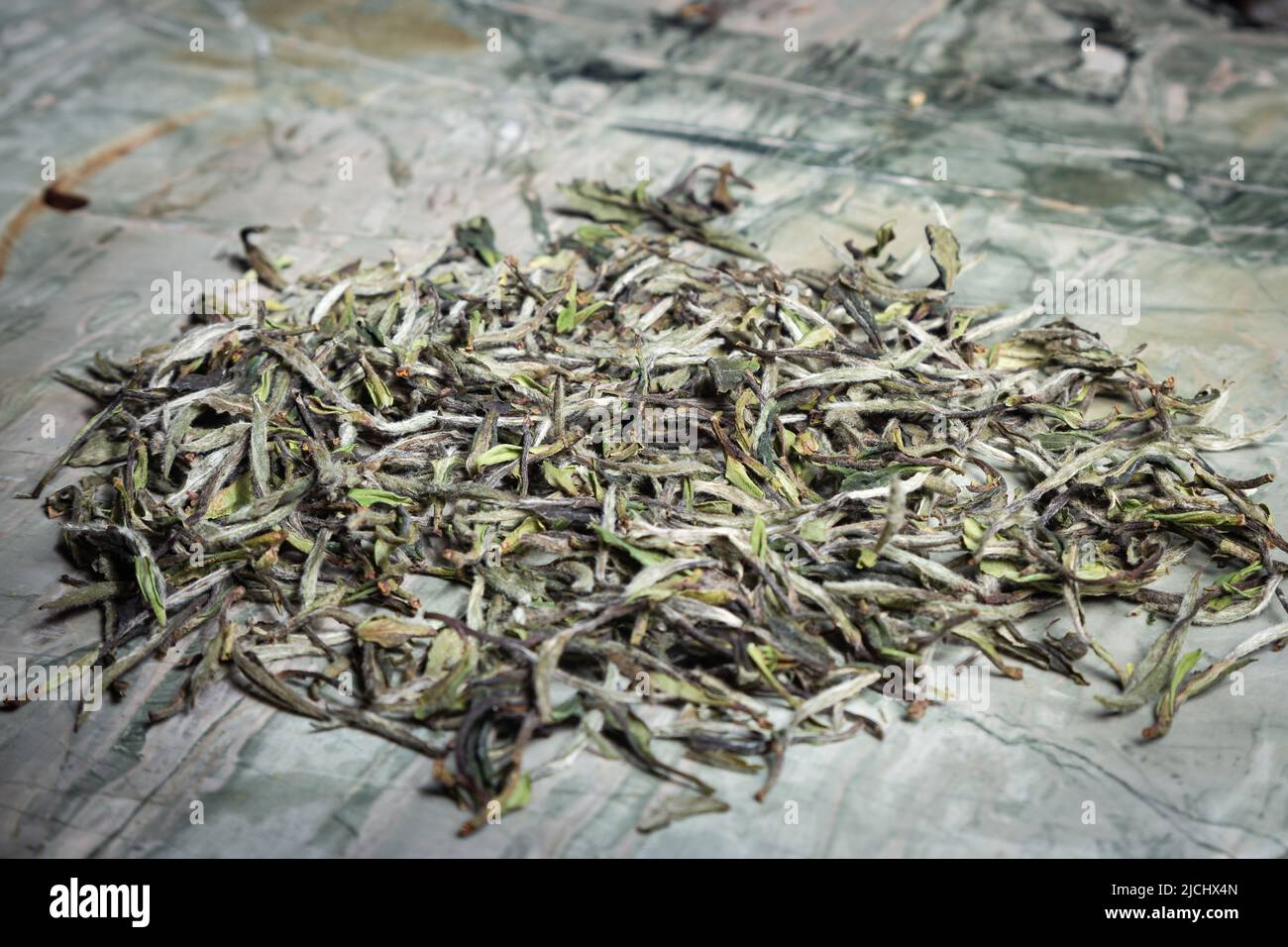 Pu-erh fermented Chinese tea in a roll Stock Photo - Alamy