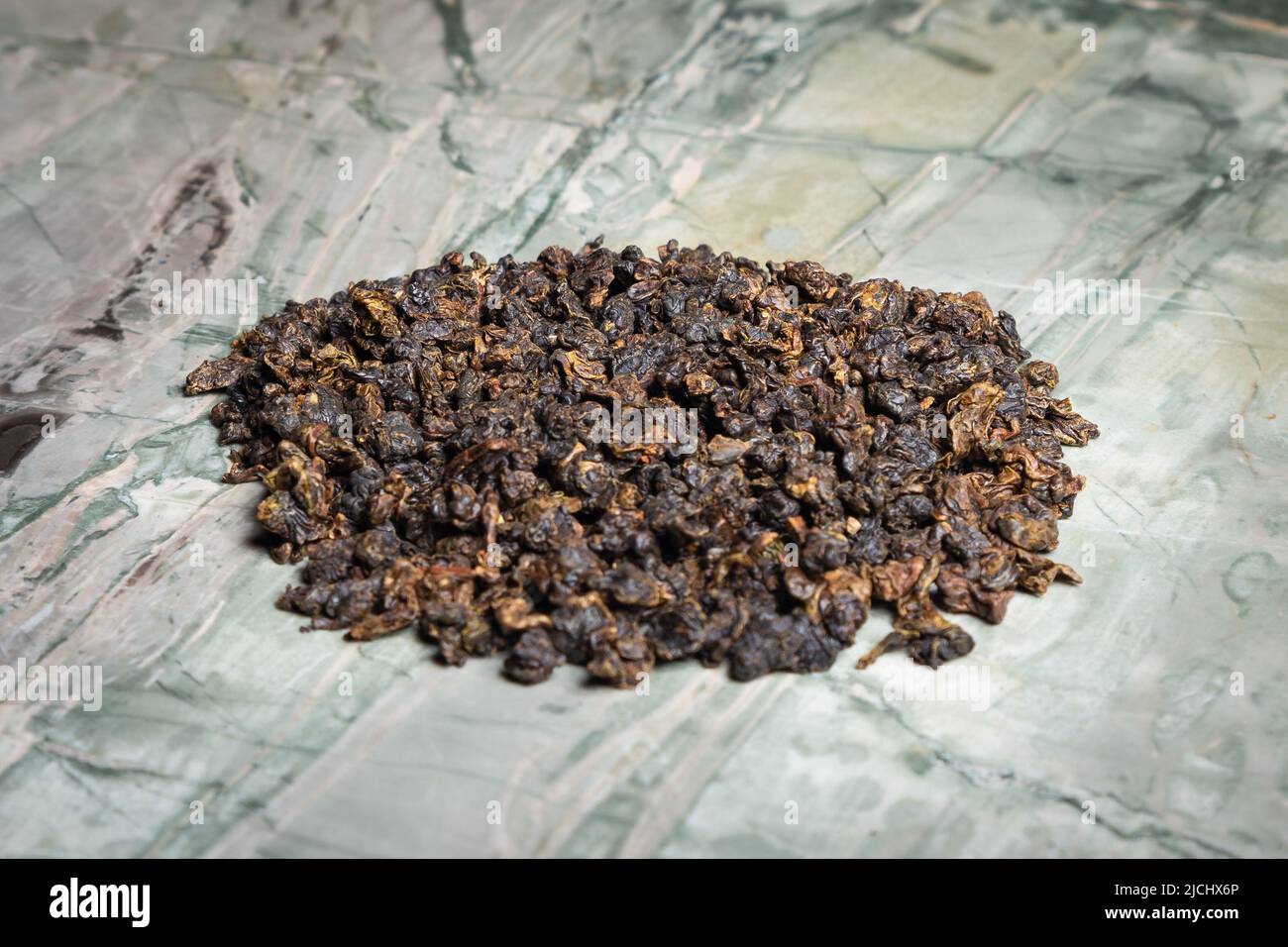 Pu-erh fermented Chinese tea in a roll Stock Photo - Alamy