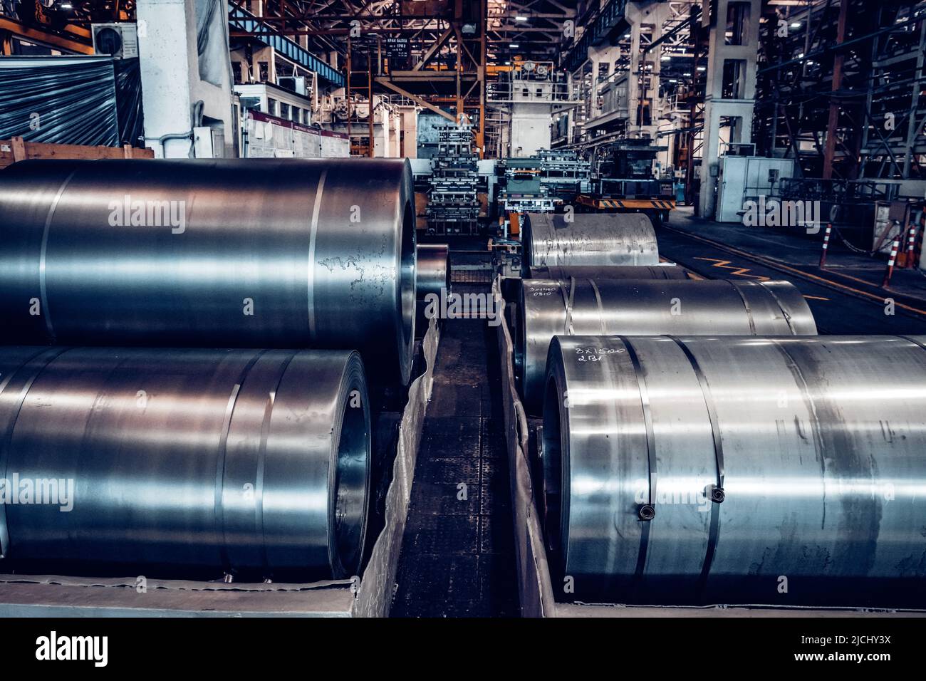 Warehouse with rolls of sheet steel in industrial plant. Hardware ...