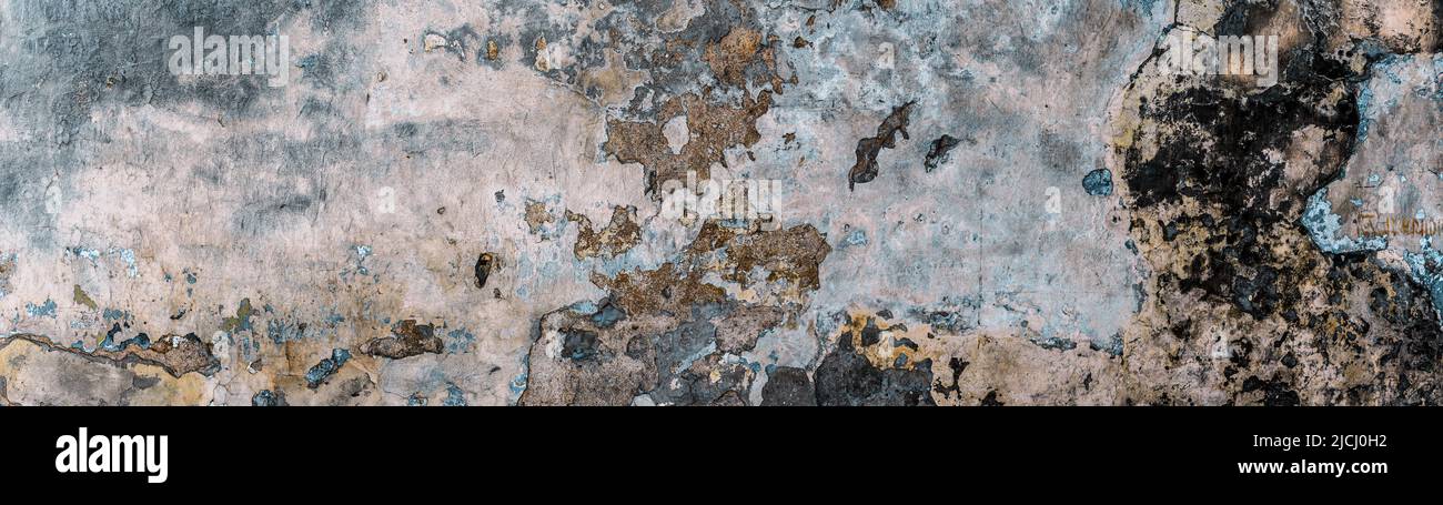 Panoramic background. The wall is collapsing due to moisture problems ...