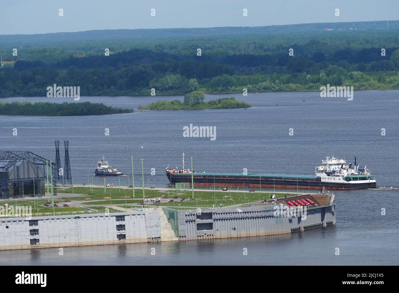 The barge is moving along the Volga River. Panorama of Strelka, the ...