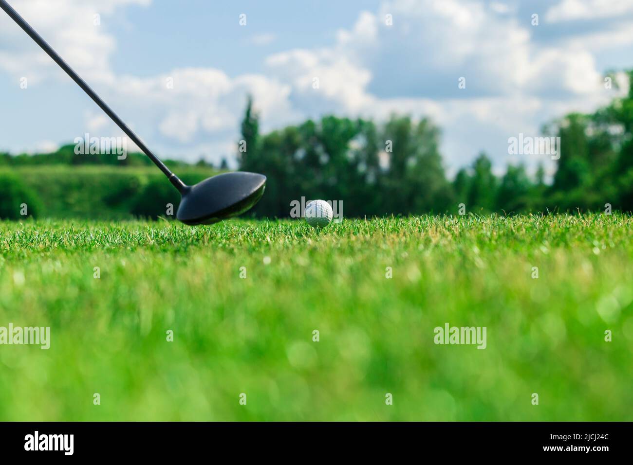 Playing golf. Golf course. Golf ball and club Stock Photo - Alamy