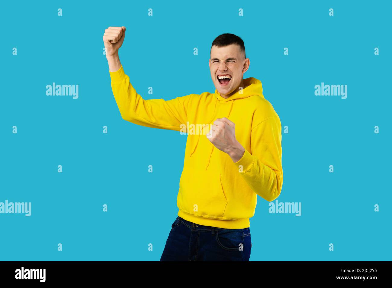 Emotional Man Shaking Fists Shouting Celebrating Victory On Blue ...