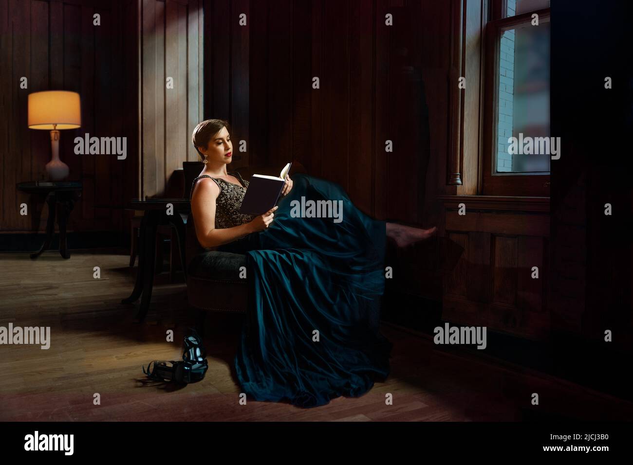 A young woman slips out of a party to find a quiet corner, reading a ...