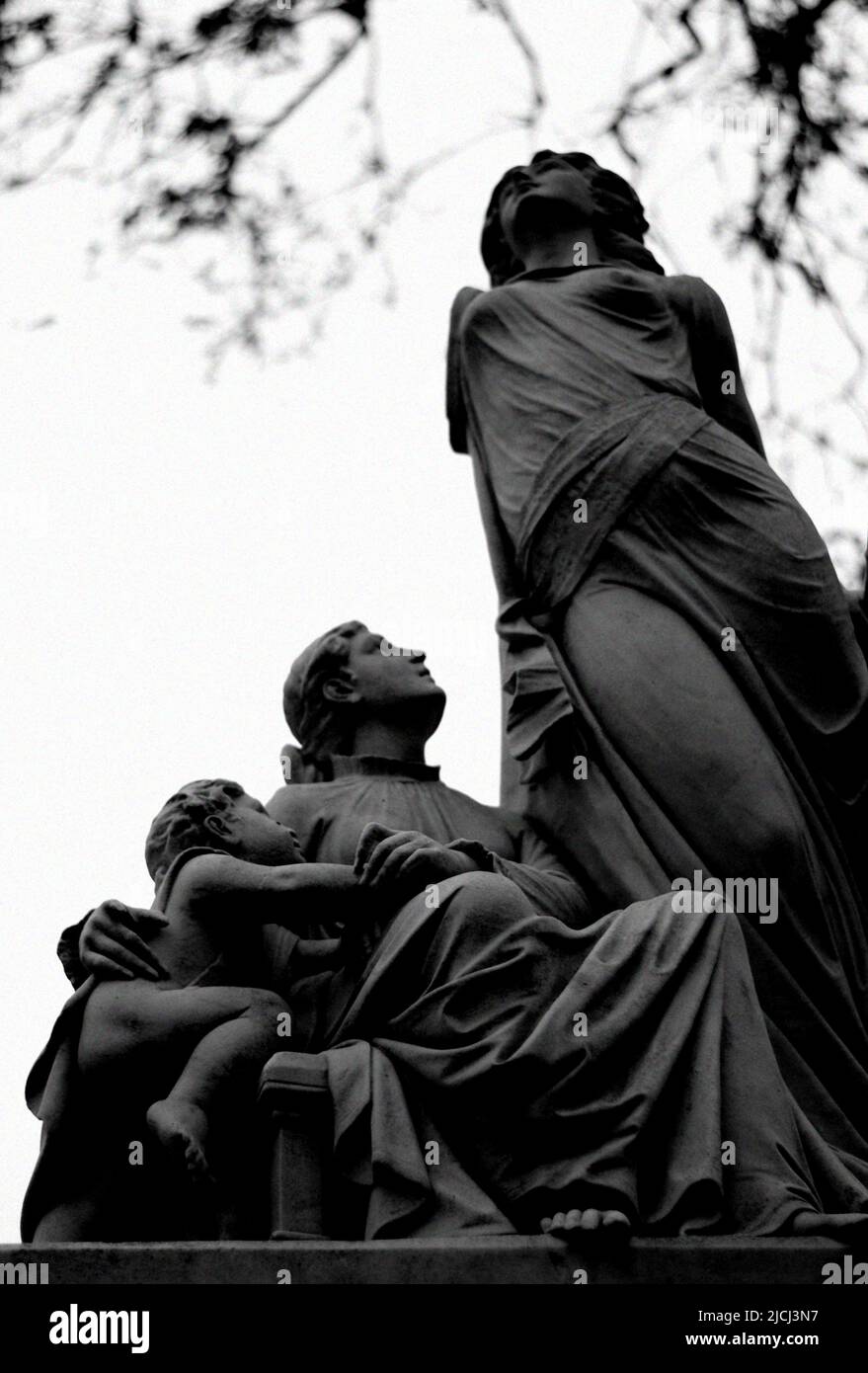 Cemetery statues edited in black and white Stock Photo - Alamy