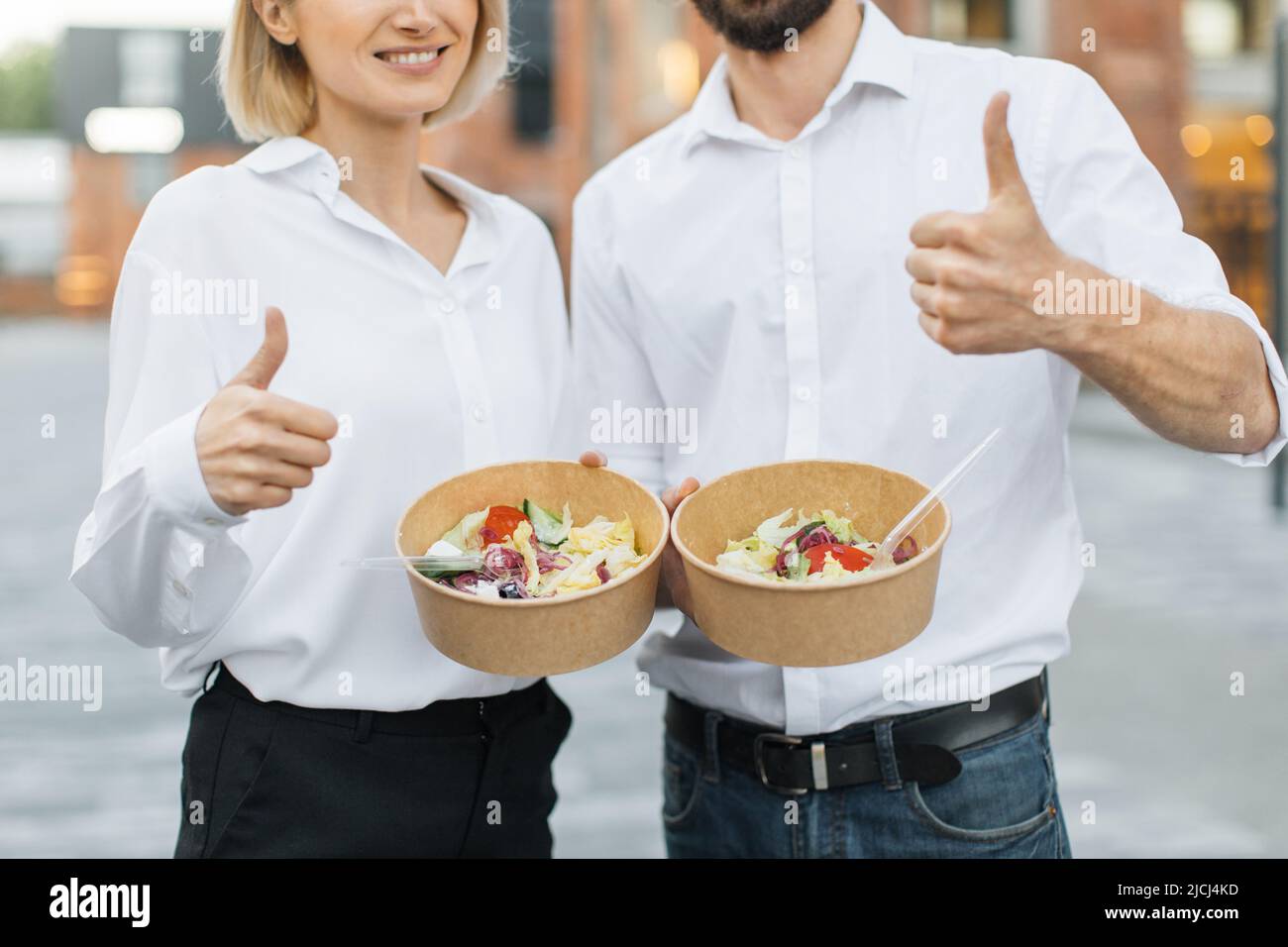 Business man eating snack walking hi-res stock photography and images ...