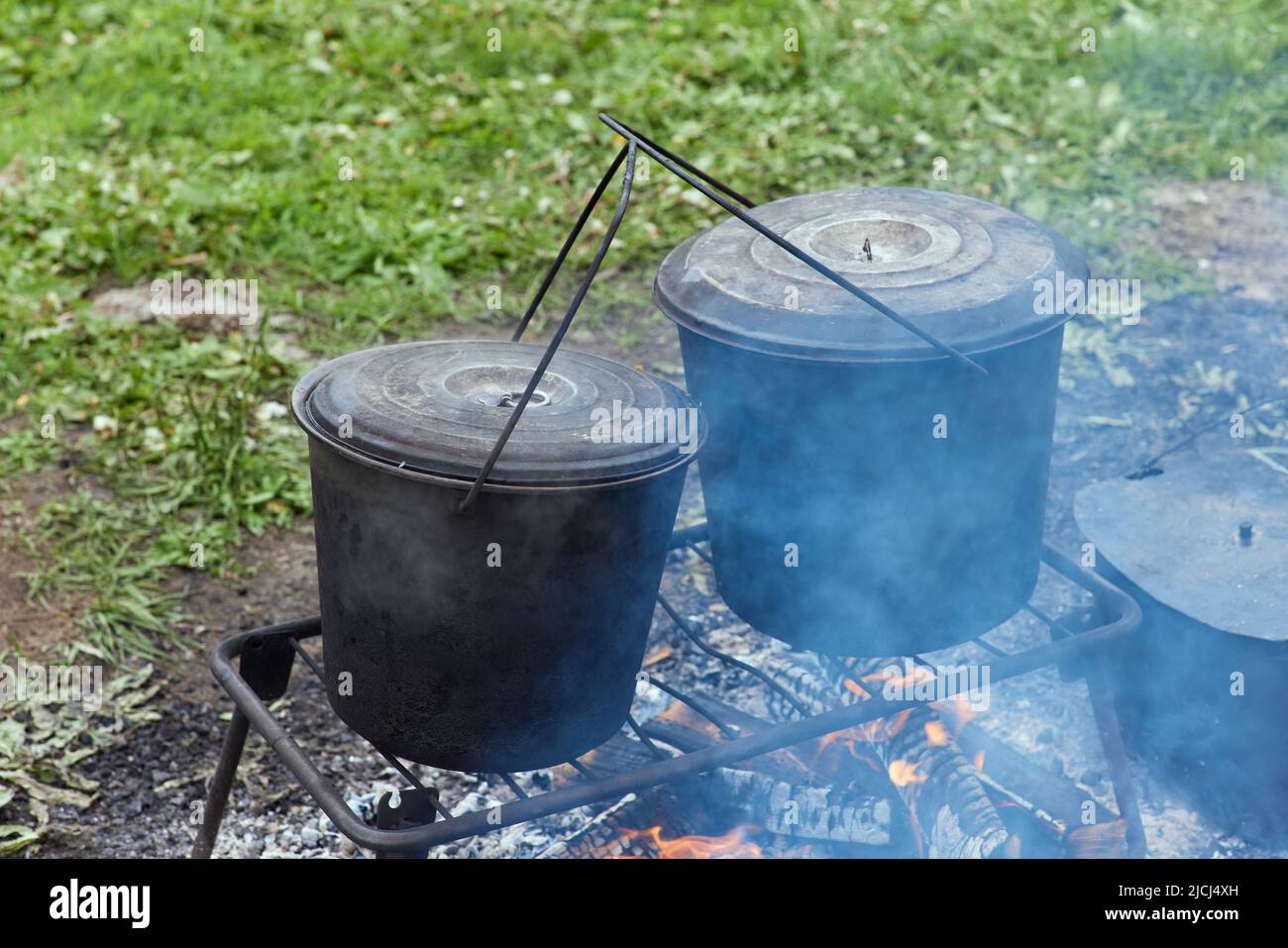Hiking pot, Bowler in the bonfire. in cauldron at the stake. Traveling ...