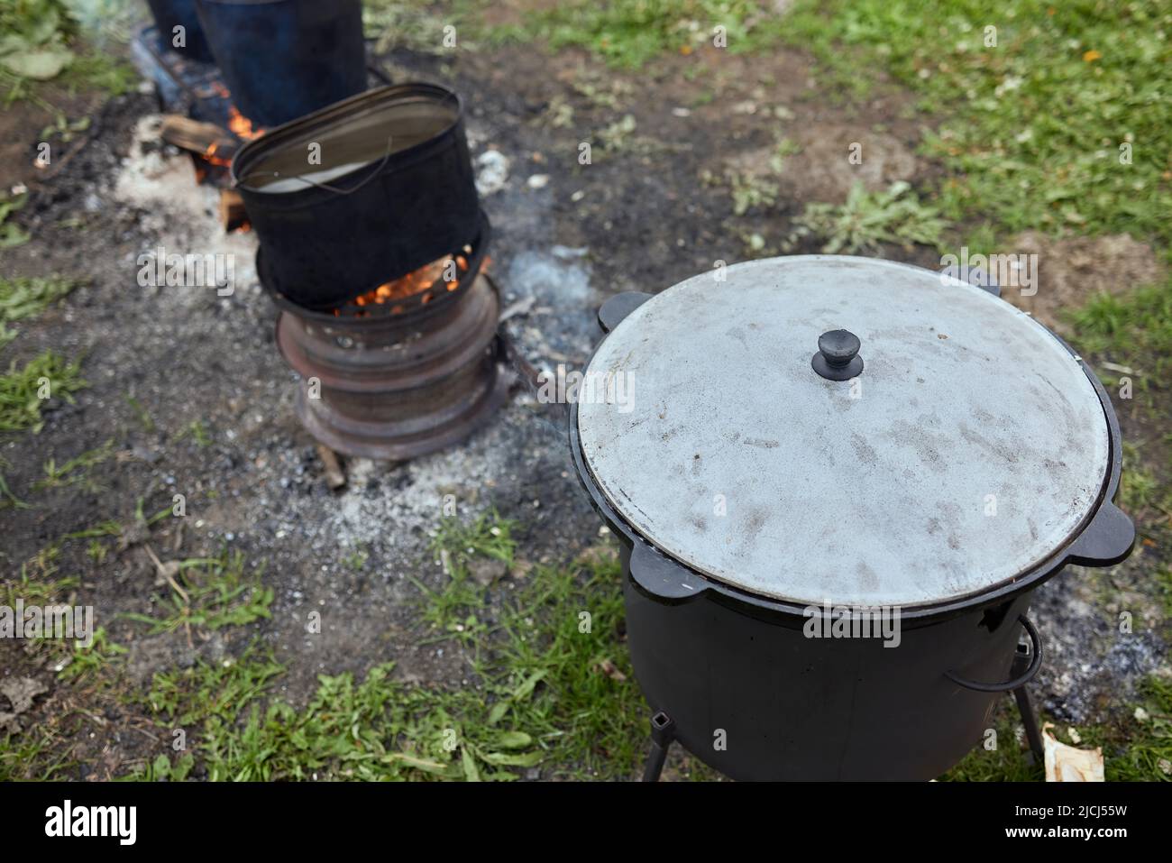 Hiking pot, Bowler in the bonfire. in cauldron at the stake. Traveling ...