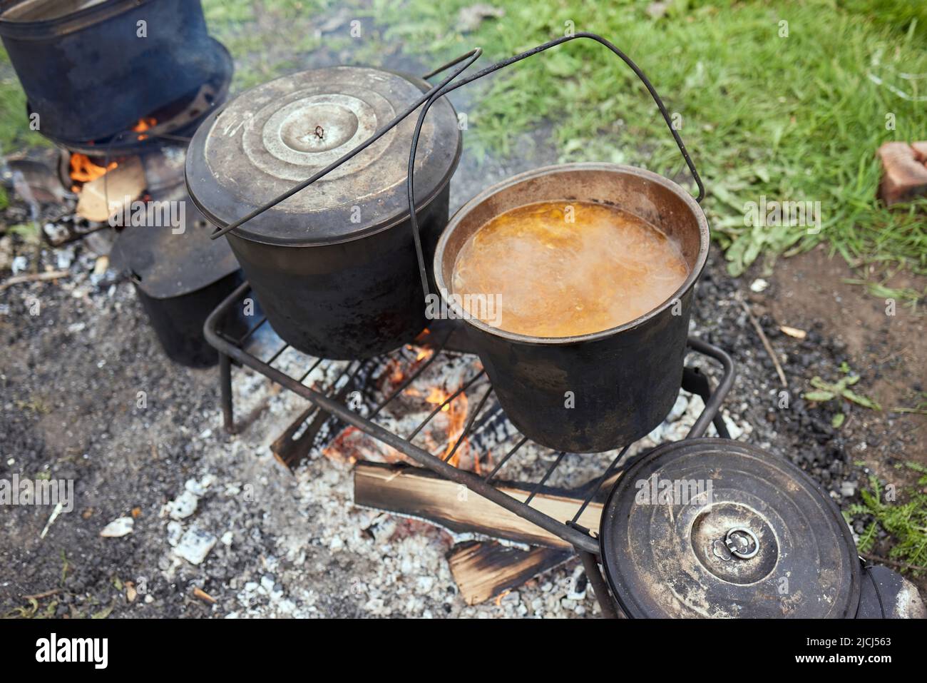 Hiking pot, Bowler in the bonfire. in cauldron at the stake. Traveling ...