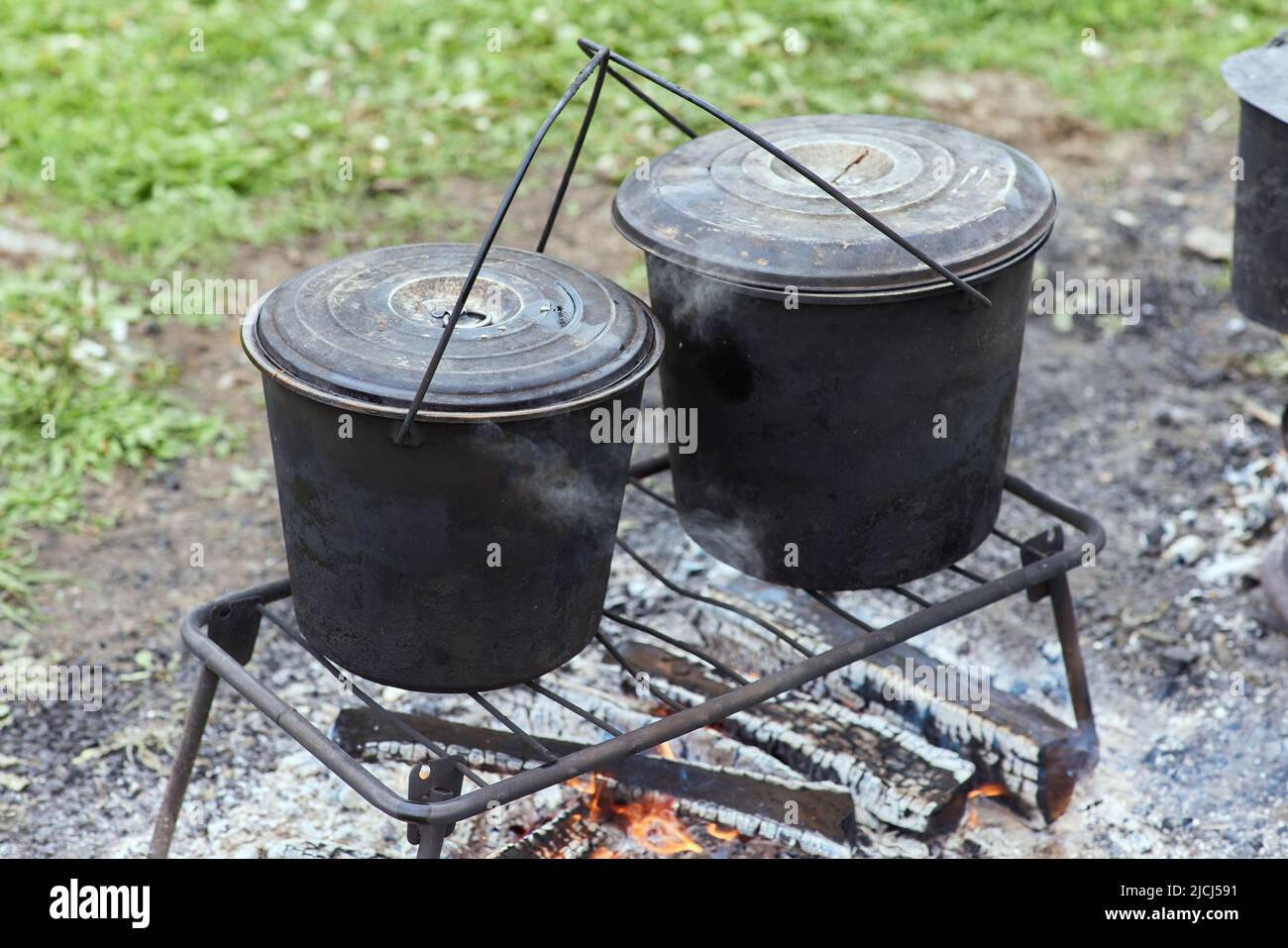 Hiking pot, Bowler in the bonfire. in cauldron at the stake. Traveling ...