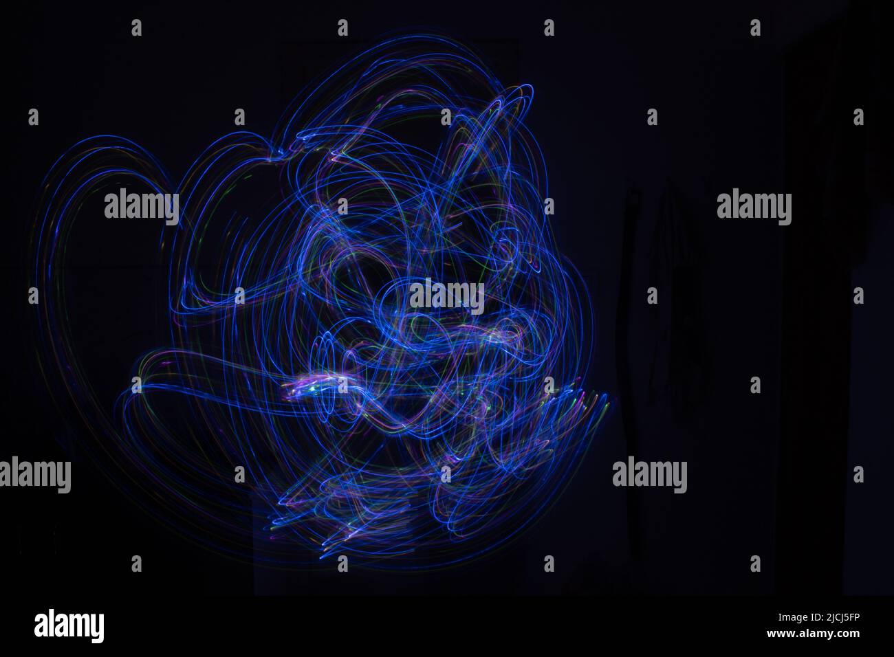 Light painting Abstract colorful irregular lines or patterns on black ...