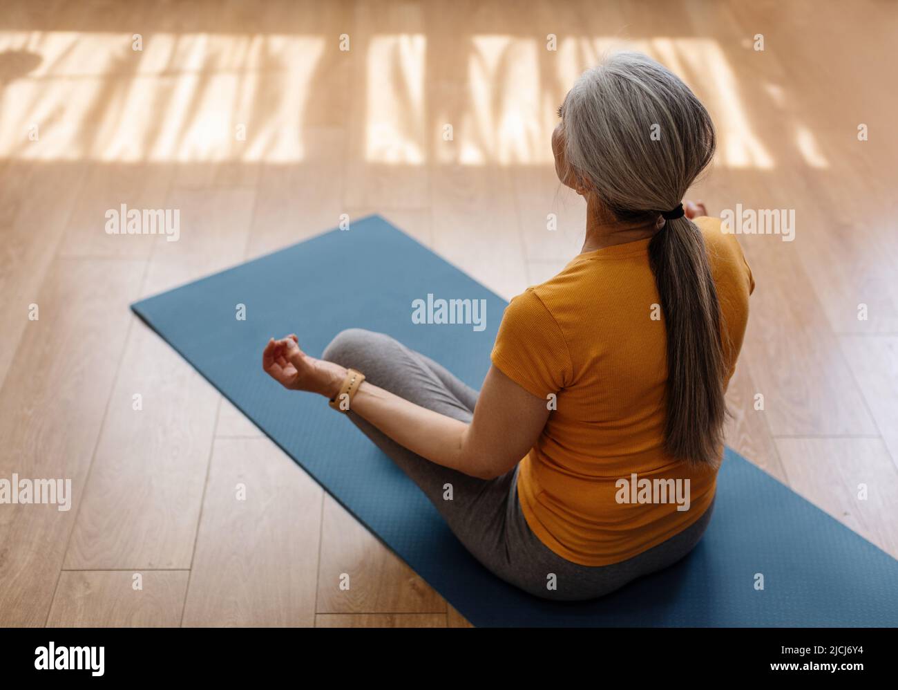 Elderly lady gymnastics yoga meditation hi-res stock photography and ...