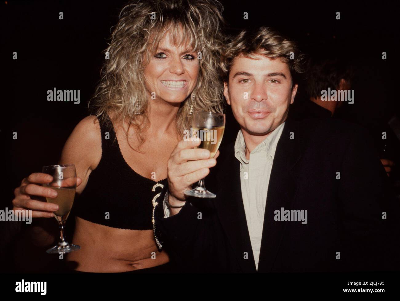 London, UK. LIBRARY. Sharon Sinclair and David Van Day. At a party ...