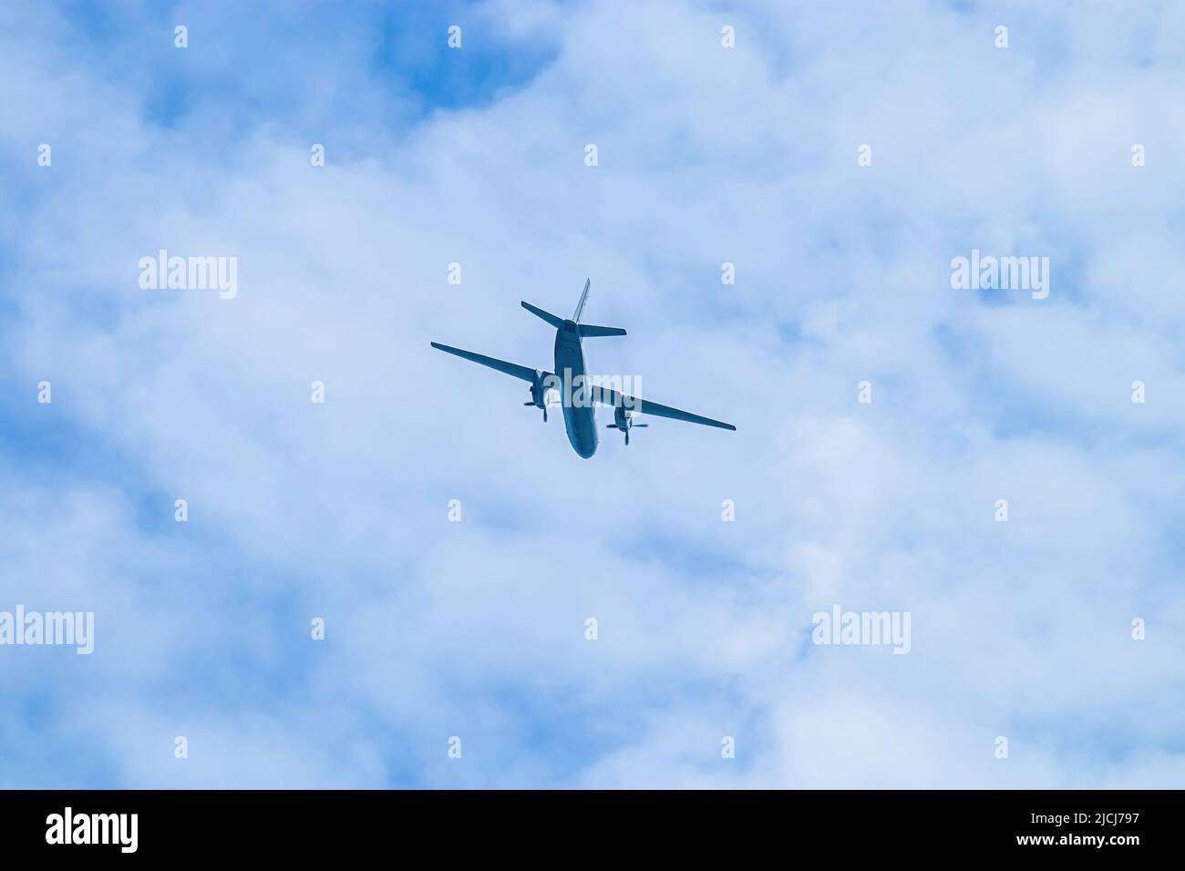 Airplane in blue sky. Air cargo transportation. Plane is flying in the ...