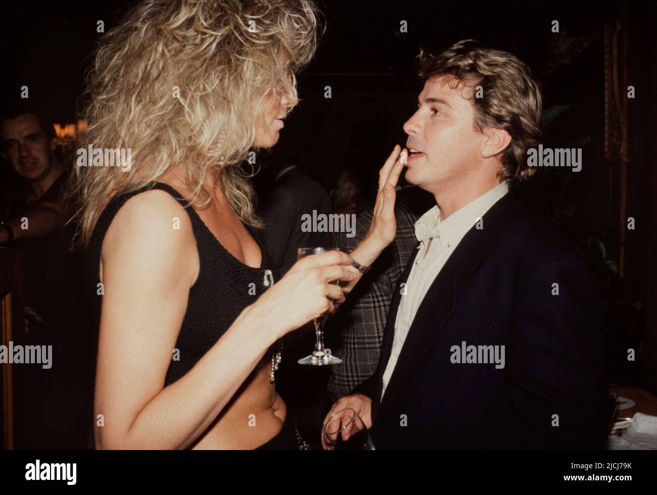 London, UK. LIBRARY. Sharon Sinclair and David Van Day. At a party ...