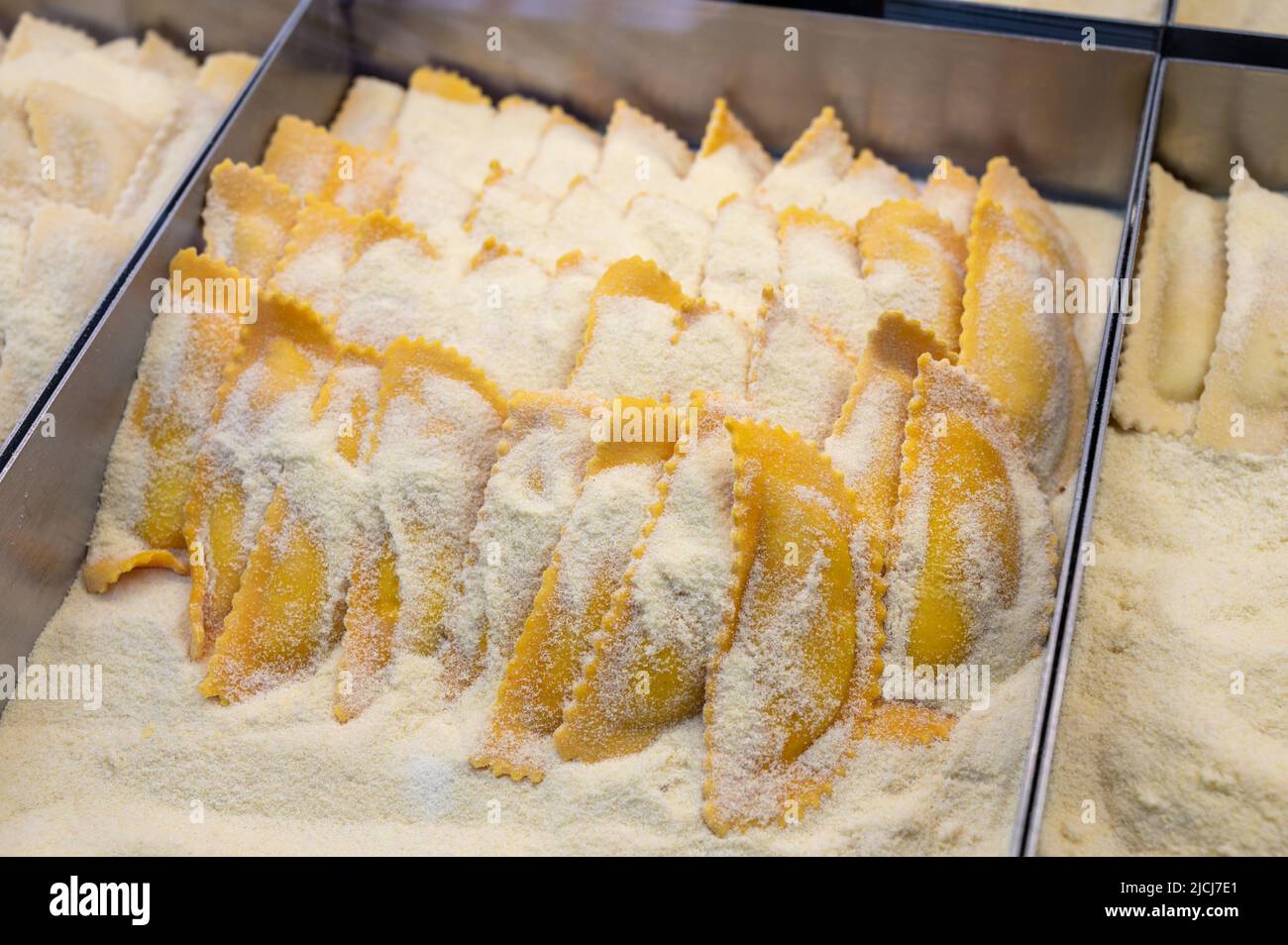 Italian food, handmade mezzaluna pasta ravioli stuffed with four ...