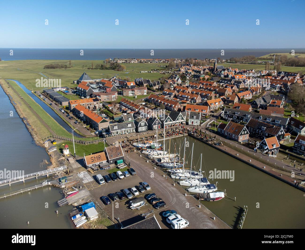 Aerial view on small Dutch town Marken with wooden houses located on ...