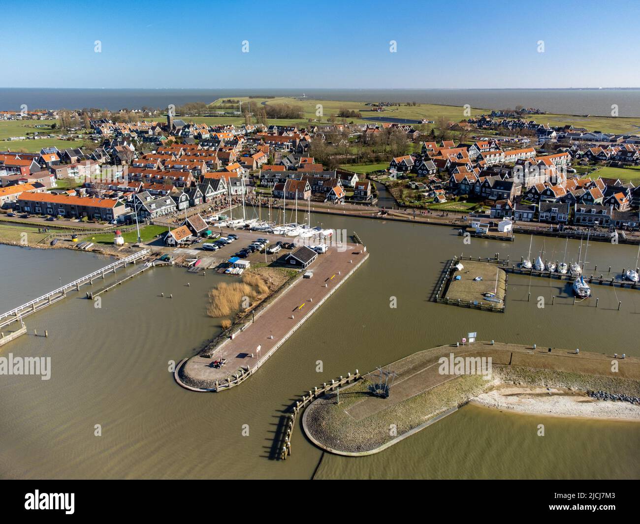 Aerial view on small Dutch town Marken with wooden houses located on ...