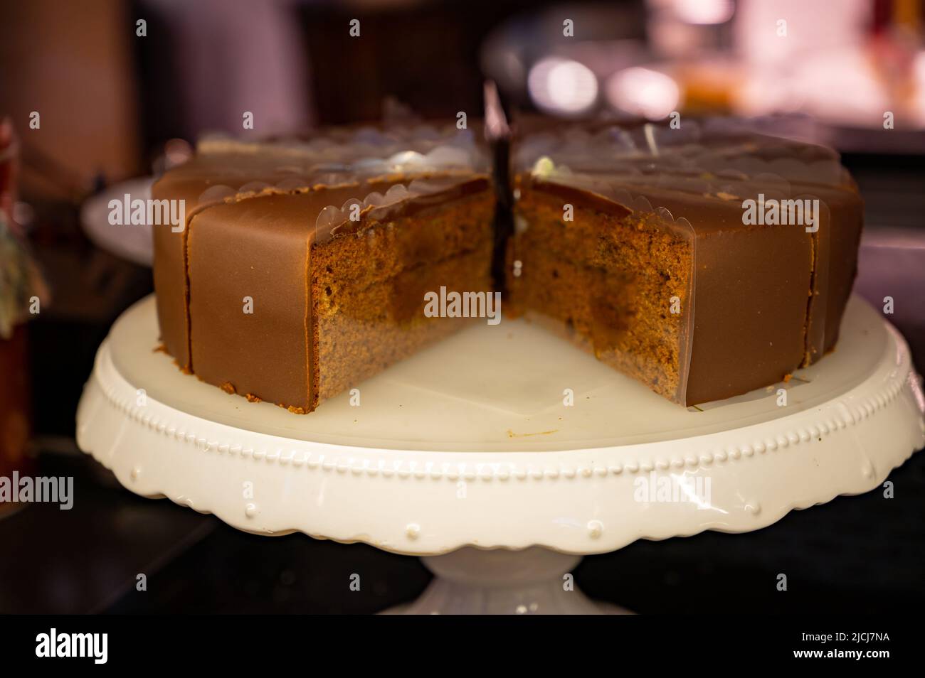 Piece of famous Sachertorte chocolate cake with apricot jam of Austrian ...