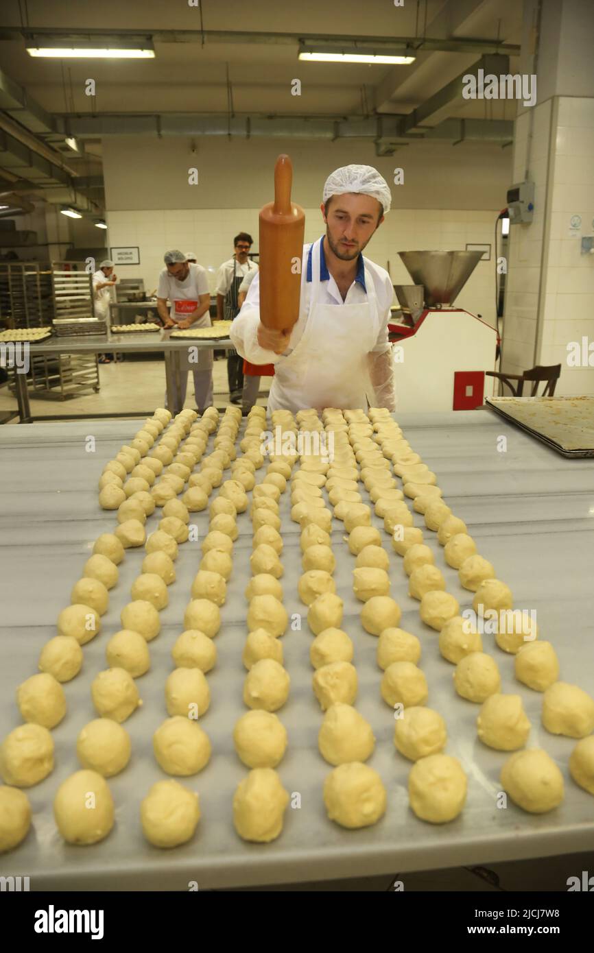 ISTANBUL, TURKEY - AUGUST 10: Turkish chef making unbaked cookies in ...