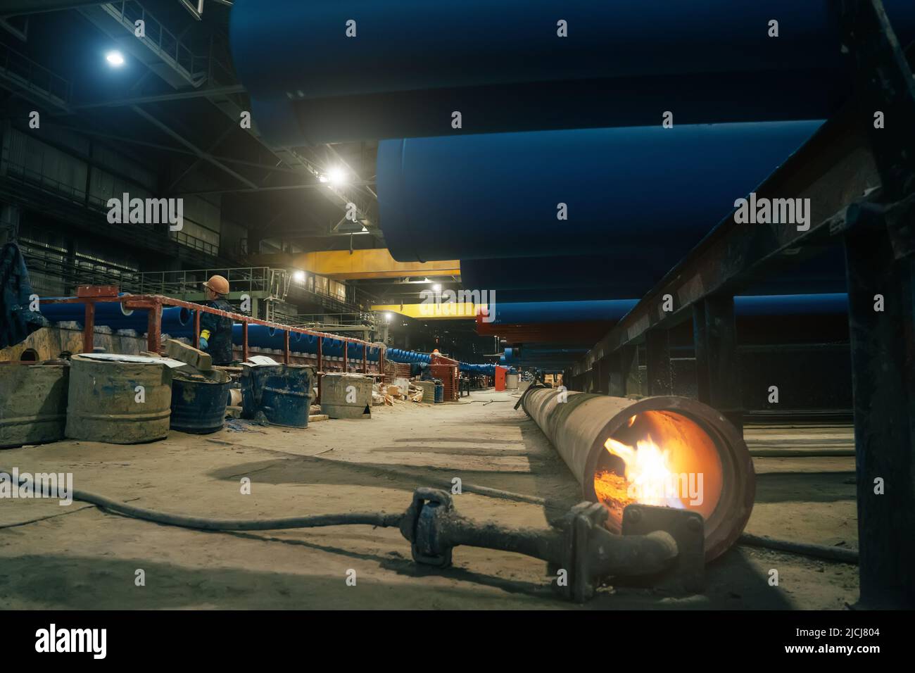 Cast iron pipes for pipeline are dried with fire and heat after ...