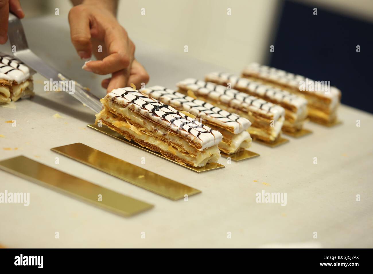 Chef making 'Vanilla cake' in the baker factory in Istanbul, Turkey ...