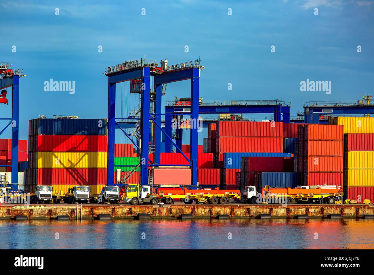 Truck in container depot in import and export area at port near sea on ...