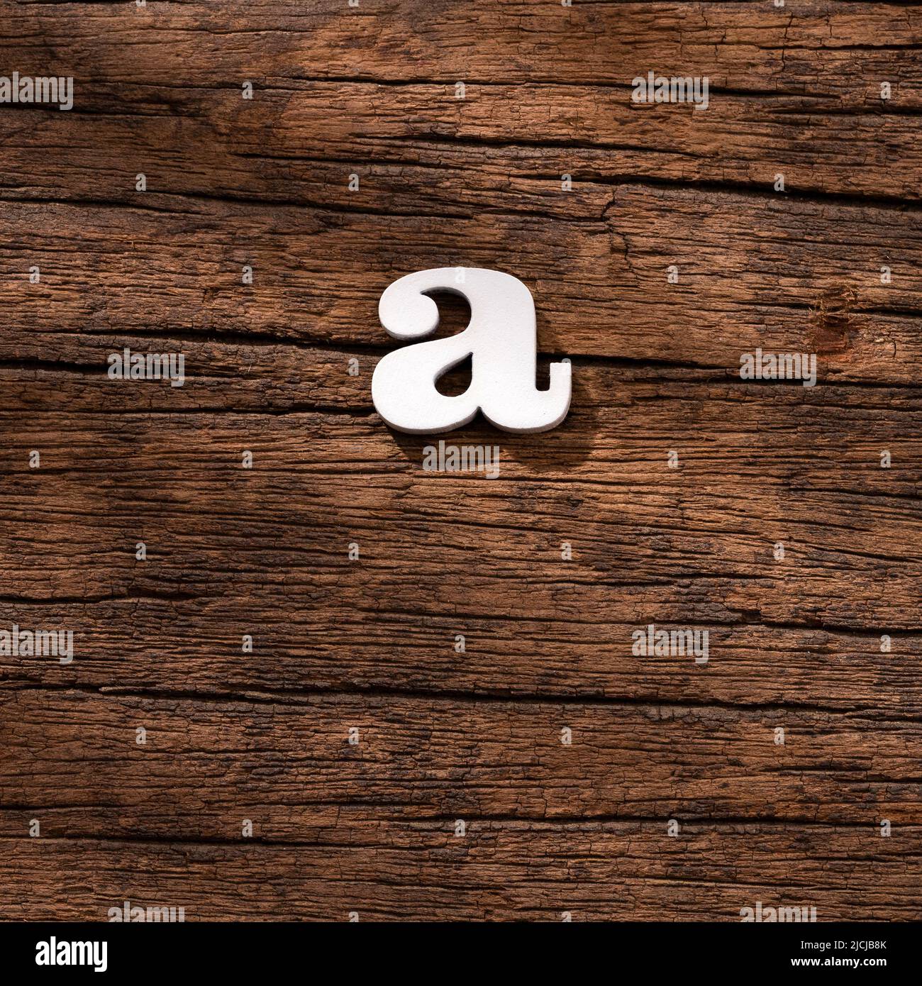 Wooden alphabet lower case letter a - Rustic background Stock Photo - Alamy