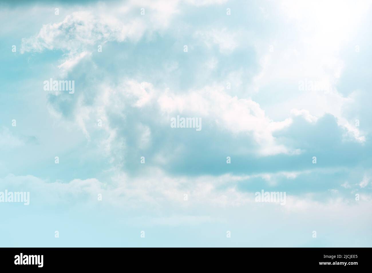 Sky. clouds and sun rays in a blue sky.Beautiful heavenly wallpaper in ...