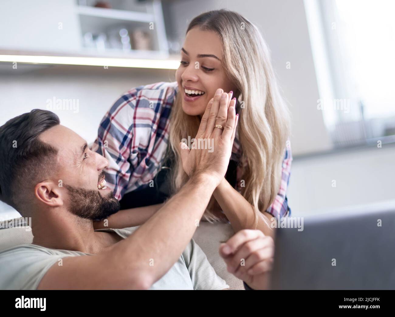 happy couple giving each other a high five Stock Photo - Alamy