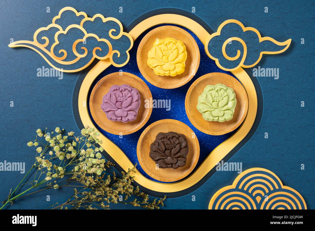 colorful flower shape snowy mooncakes with Chinese decorations Stock ...