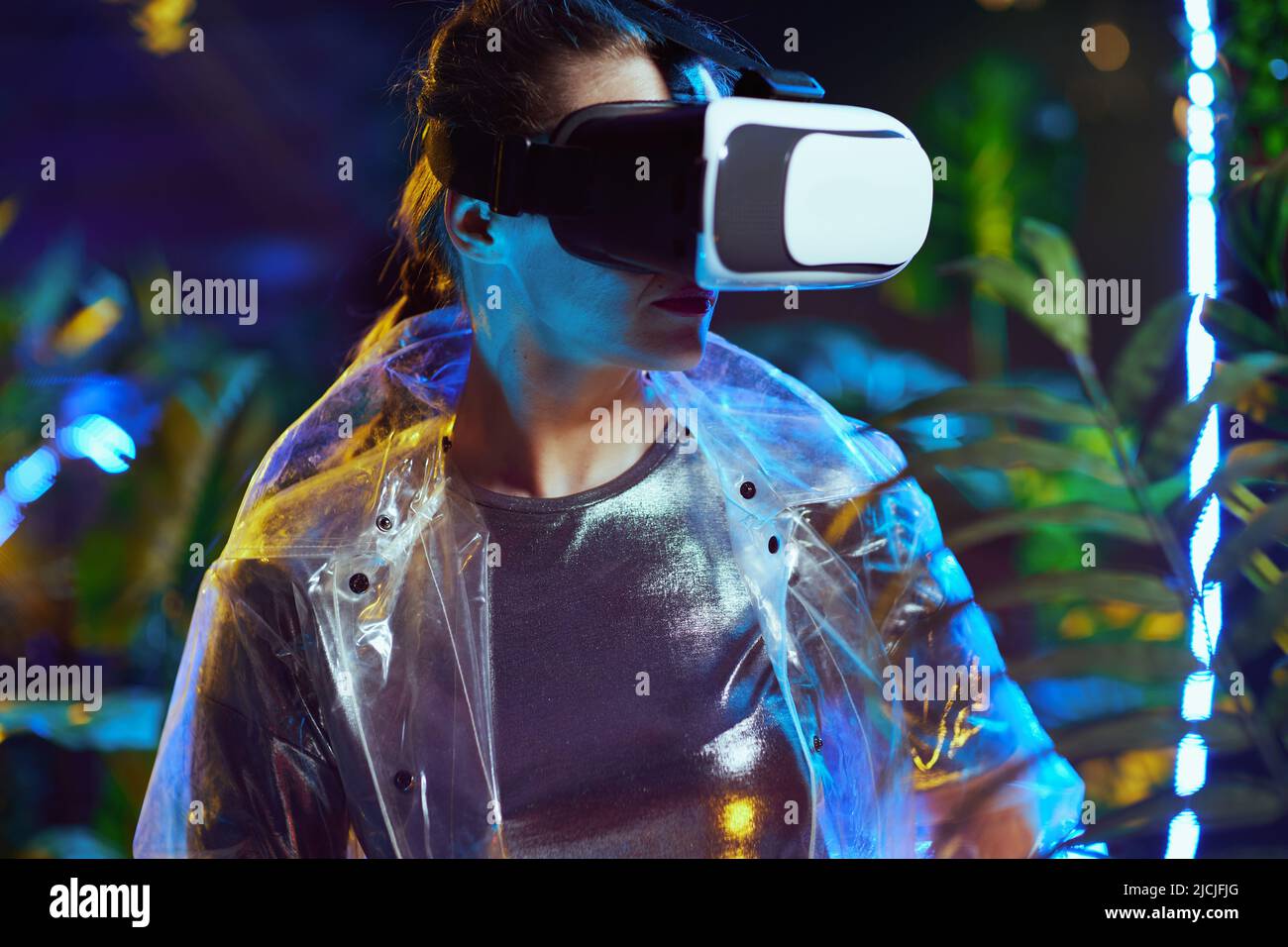 trendy female in virtual reality in vr goggles Stock Photo - Alamy