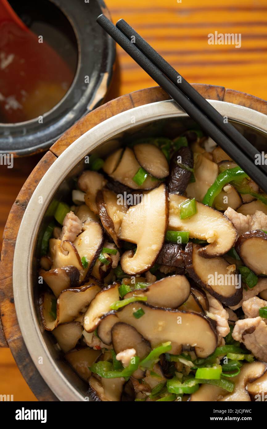 top view fast food of fried pork with slices of mushrooms with bowl of ...