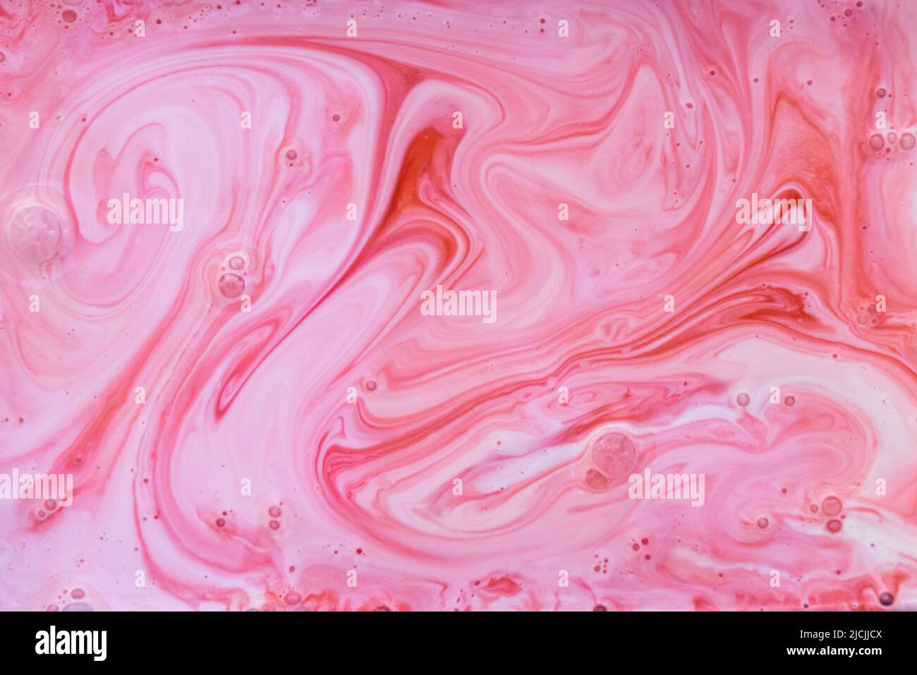 Background and texture of fresh cream mixed with fresh strawberry puree ...