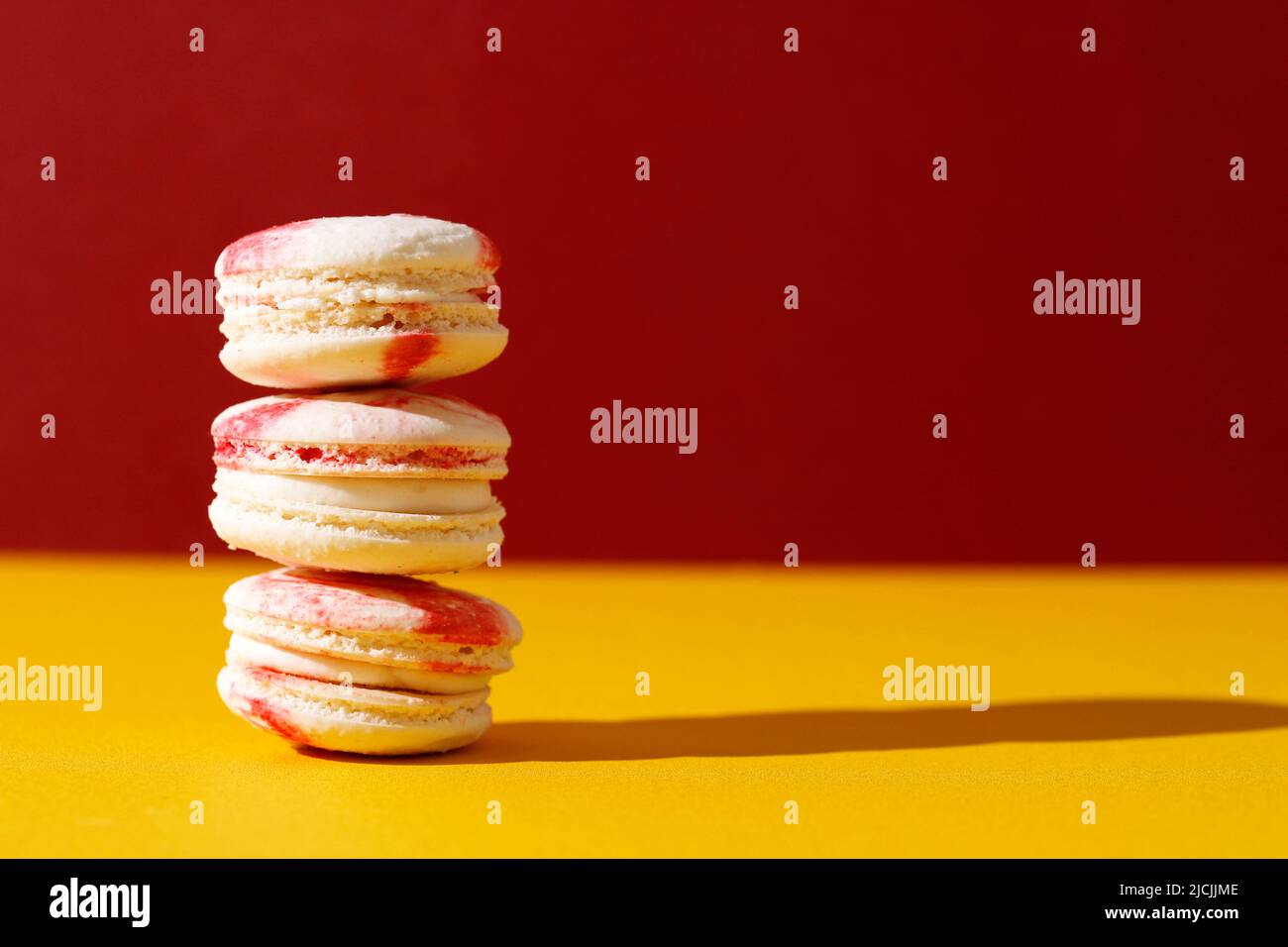 Stacked raspberries macaroon white hi-res stock photography and images ...