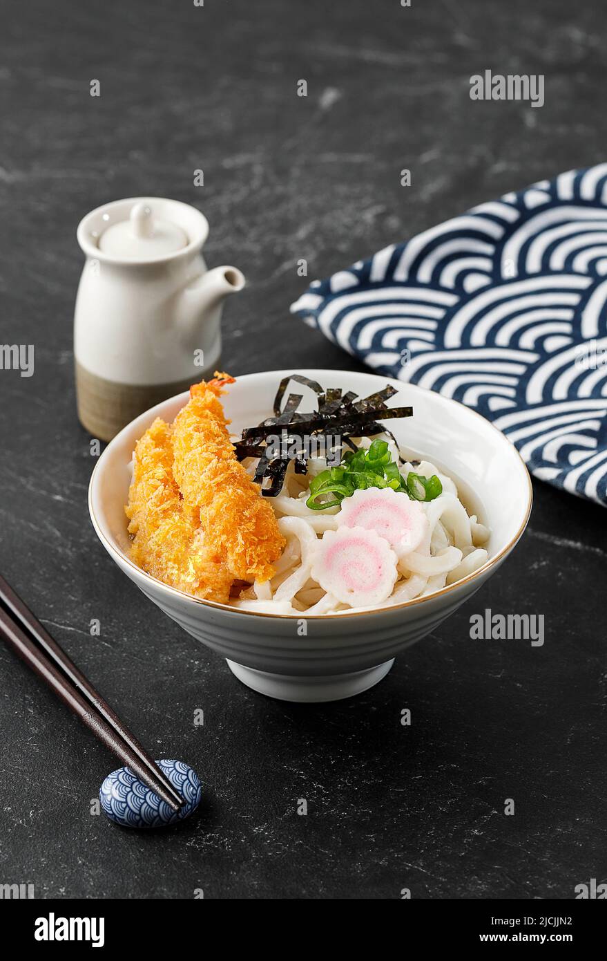 Japanese Tempura Udon Noodles on White Bowl over Black Marble Table ...