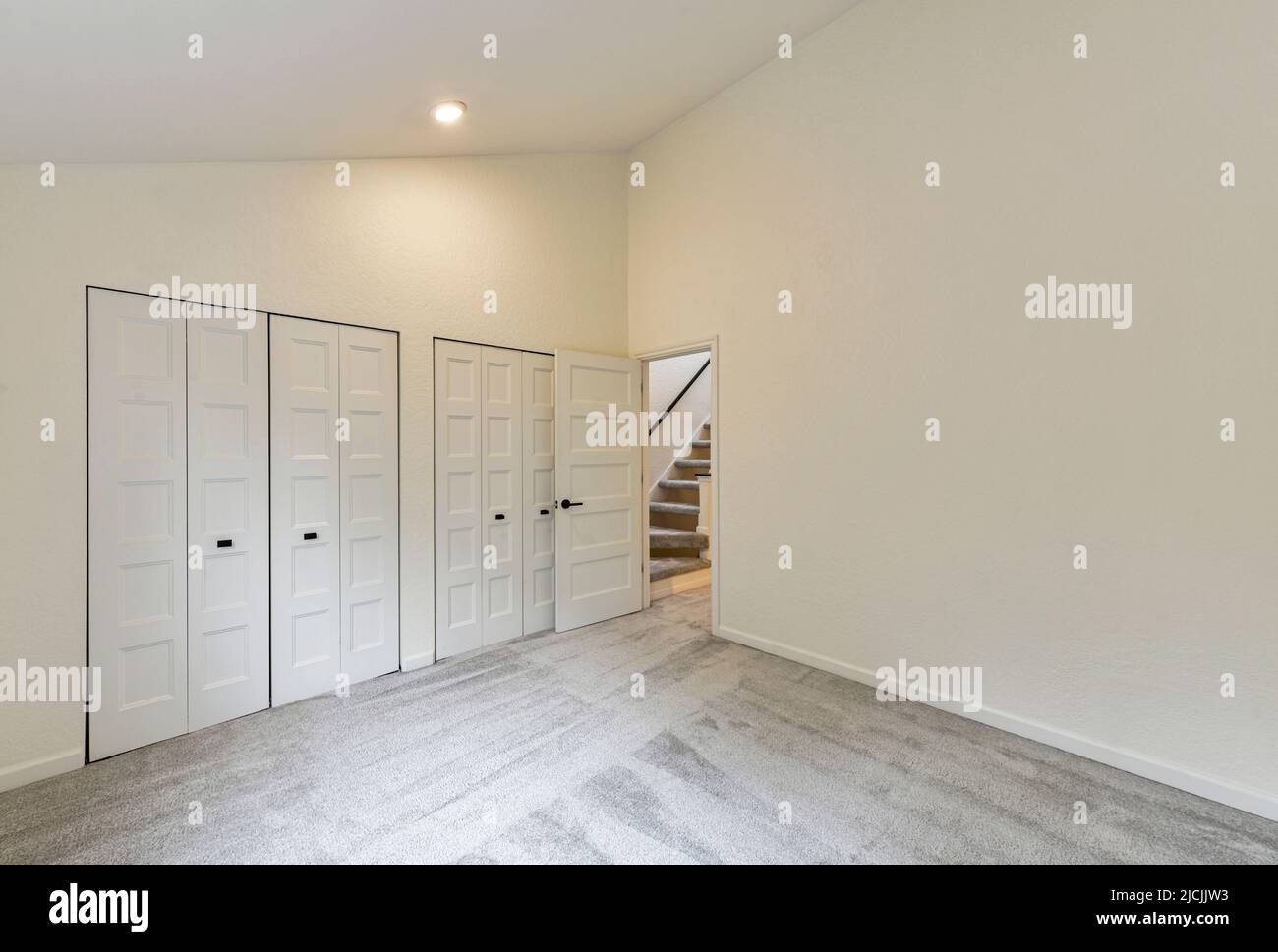 Modern residential empty bedroom interior Stock Photo - Alamy