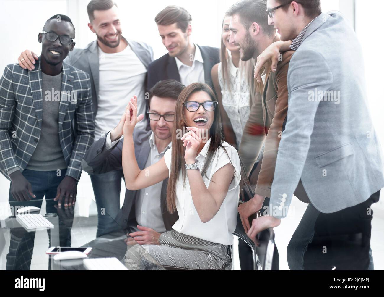 Team members high five hi-res stock photography and images - Alamy
