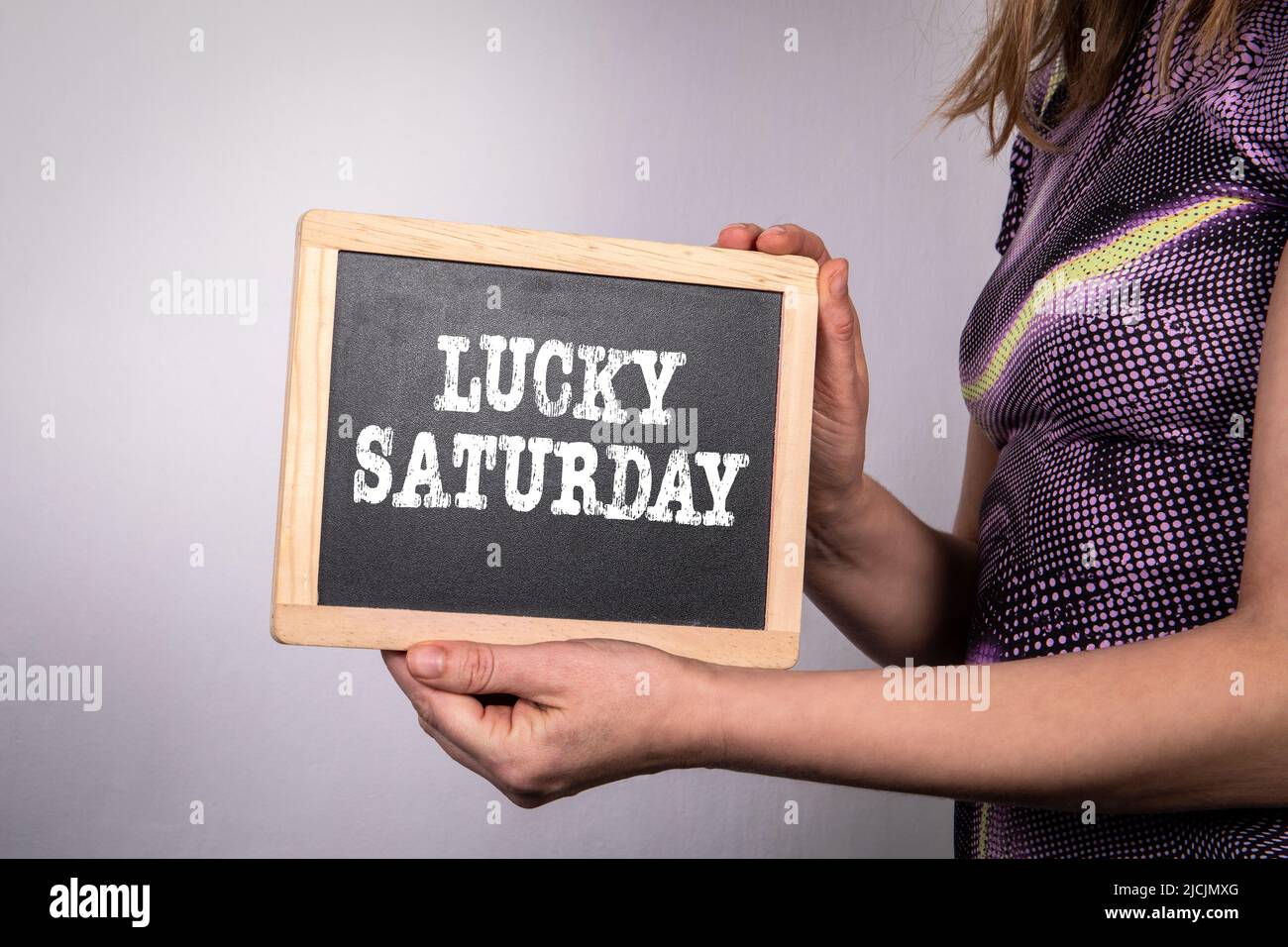 Lucky Saturday. Text on a miniature chalk board Stock Photo - Alamy