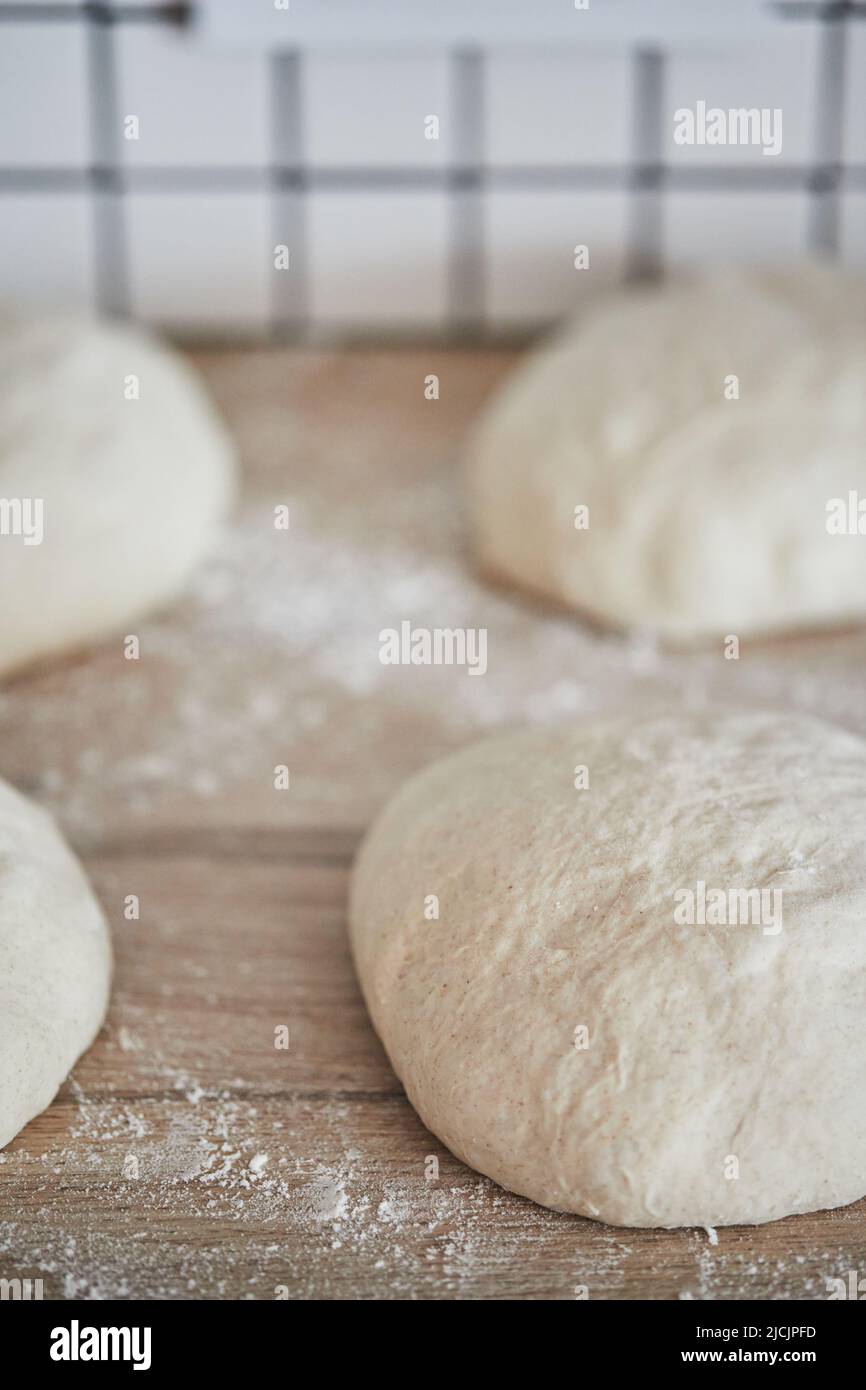 The process of making wheat bread at home. Dough shaping. The concept ...