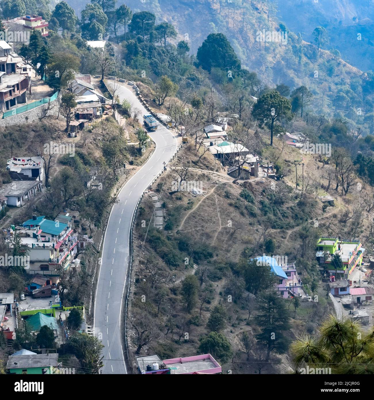 Aerial top view of traffic vehicles driving at mountains roads at ...